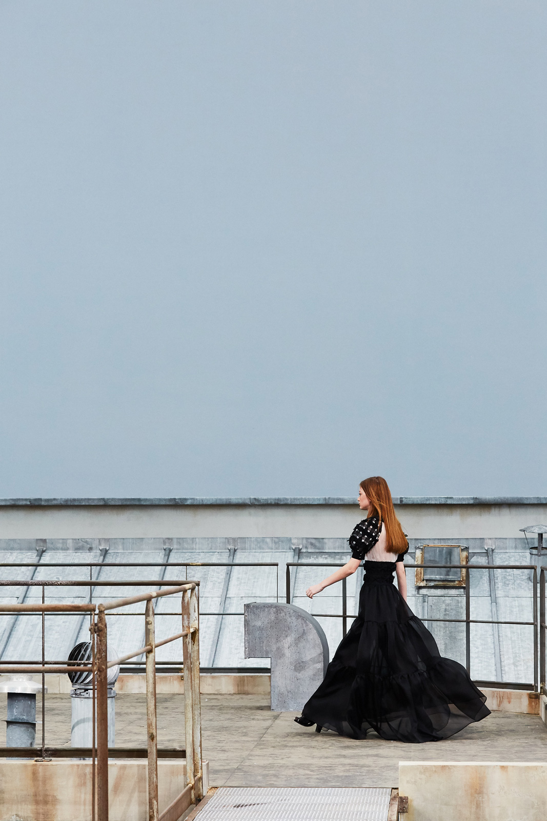 The Chanel woman has broken the glass ceiling and is lounging on the roof