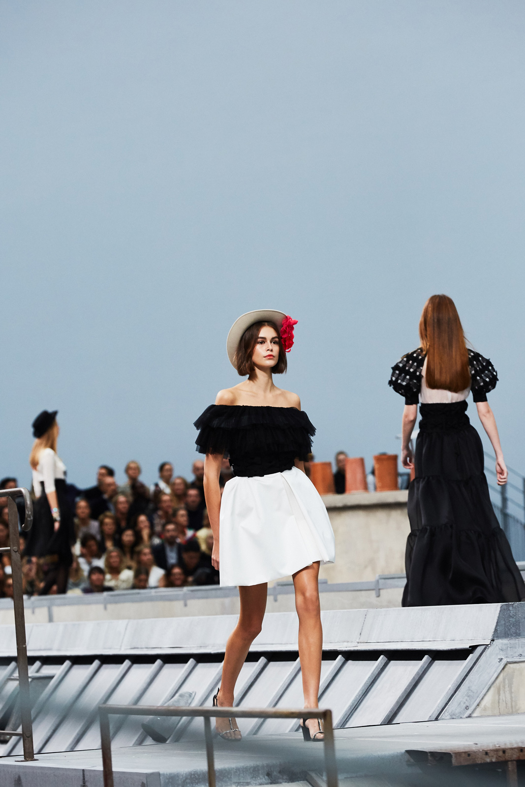The Chanel woman has broken the glass ceiling and is lounging on the roof